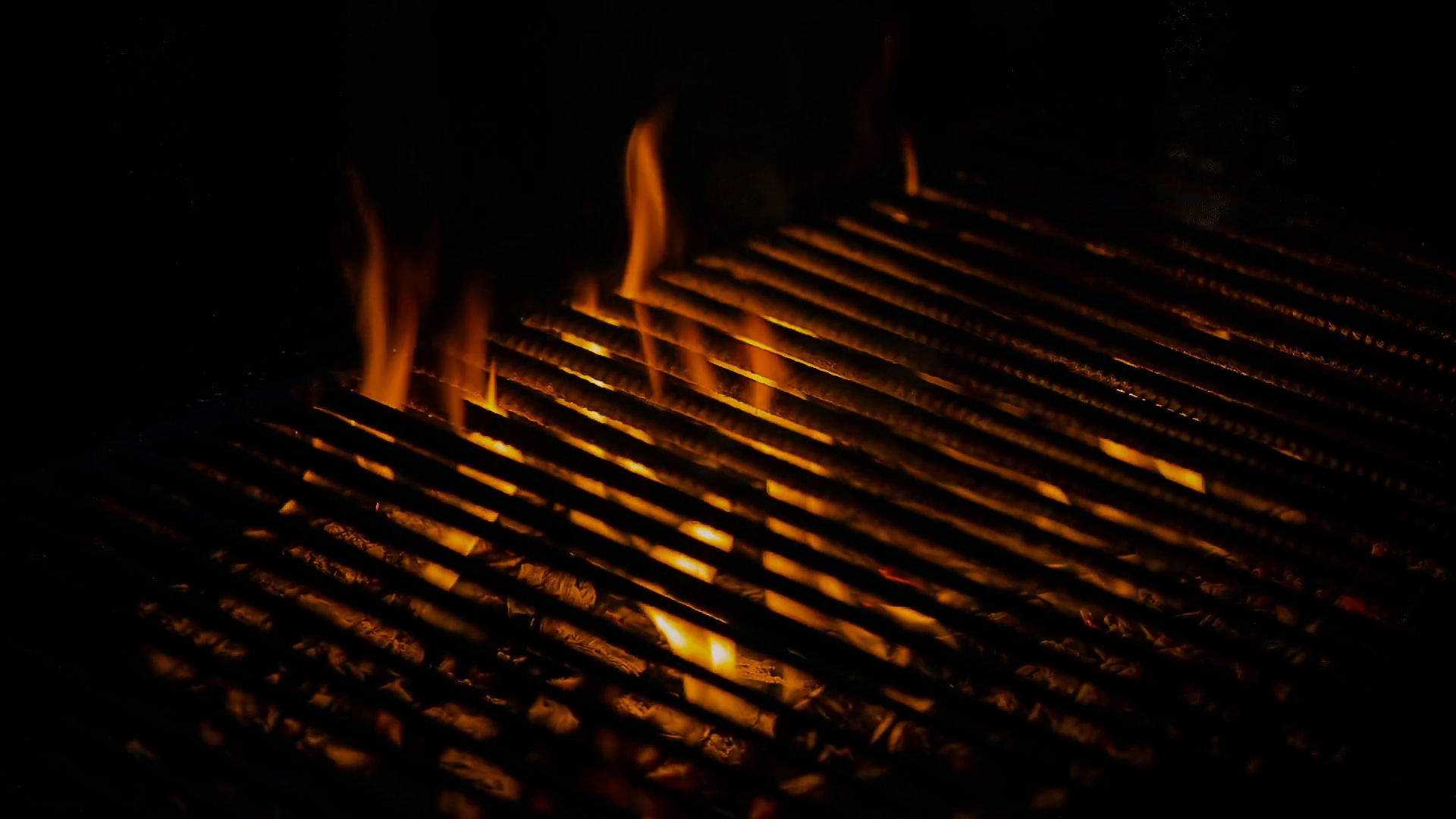 Empty hot barbecue with fire flames on black background Stock Video ...