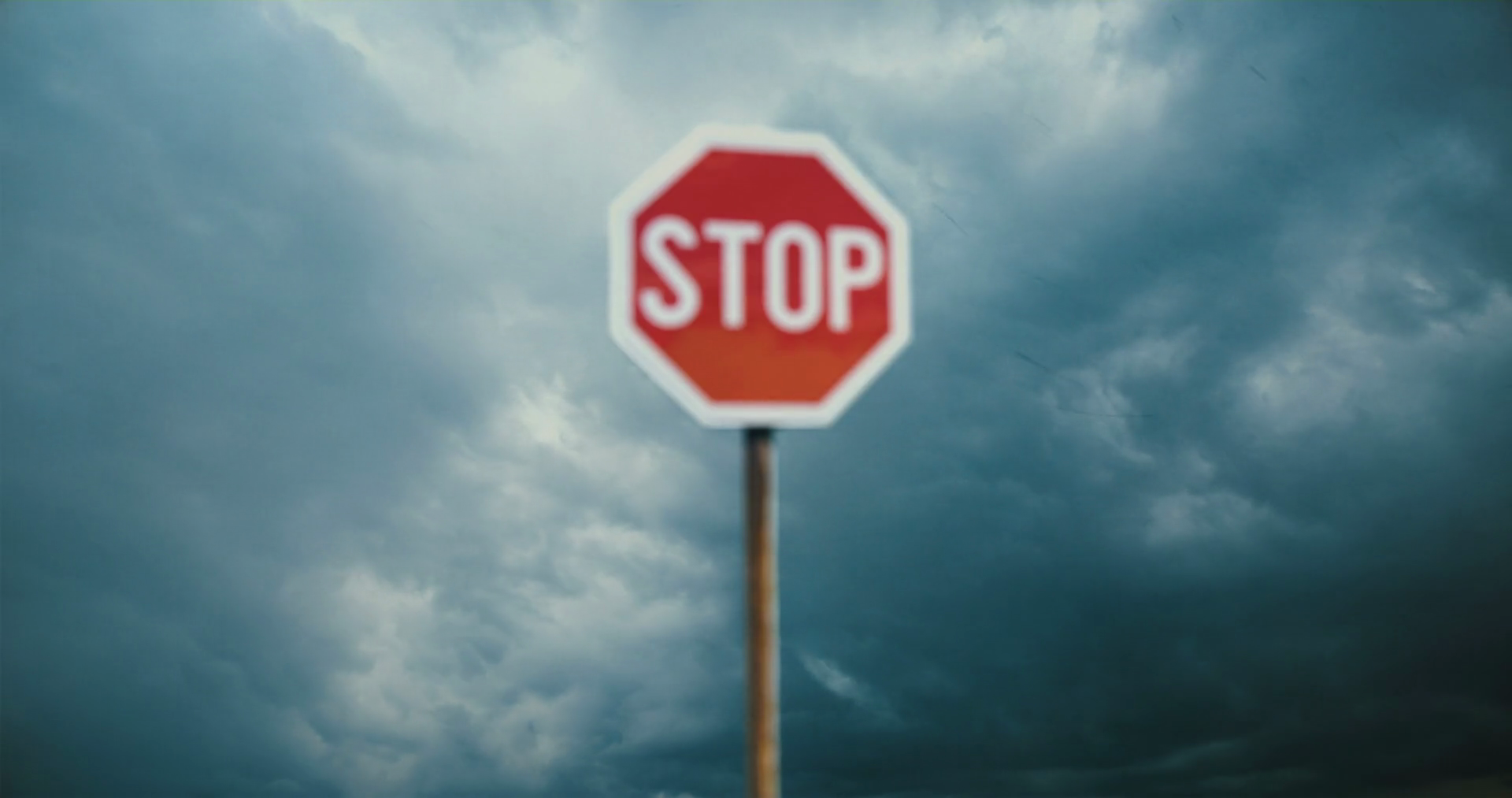 Red Stop Sign With Stormy Sky Stock Footage SBV-317603265 - Storyblocks