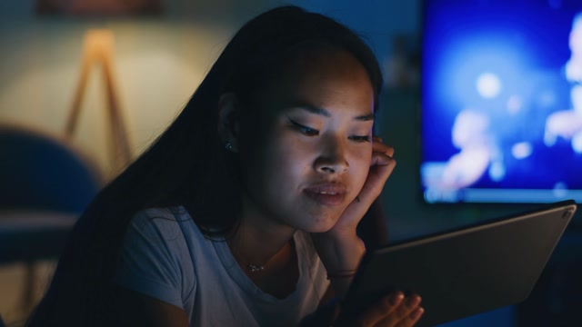 Woman Watching Video Stock Footage: Royalty-Free Video Clips - Storyblocks