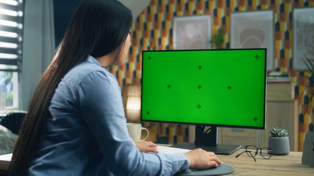 Woman Using Computer With Green Screen Display Stock Footage: Royalty ...