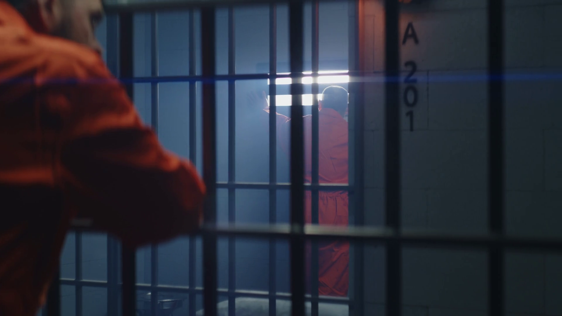 Man In Orange Uniform Stands In Jail Cell Stock Footage SBV-347787665 ...