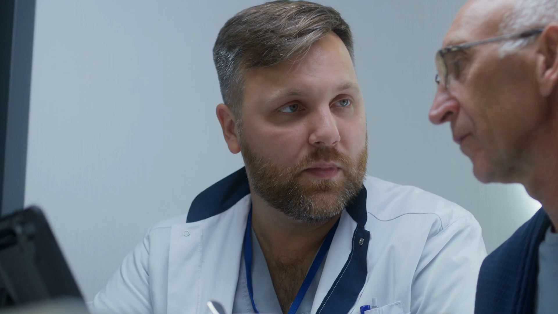Male Doctor Sits In Clinic Cafe With Elderly Stock Footage SBV ...