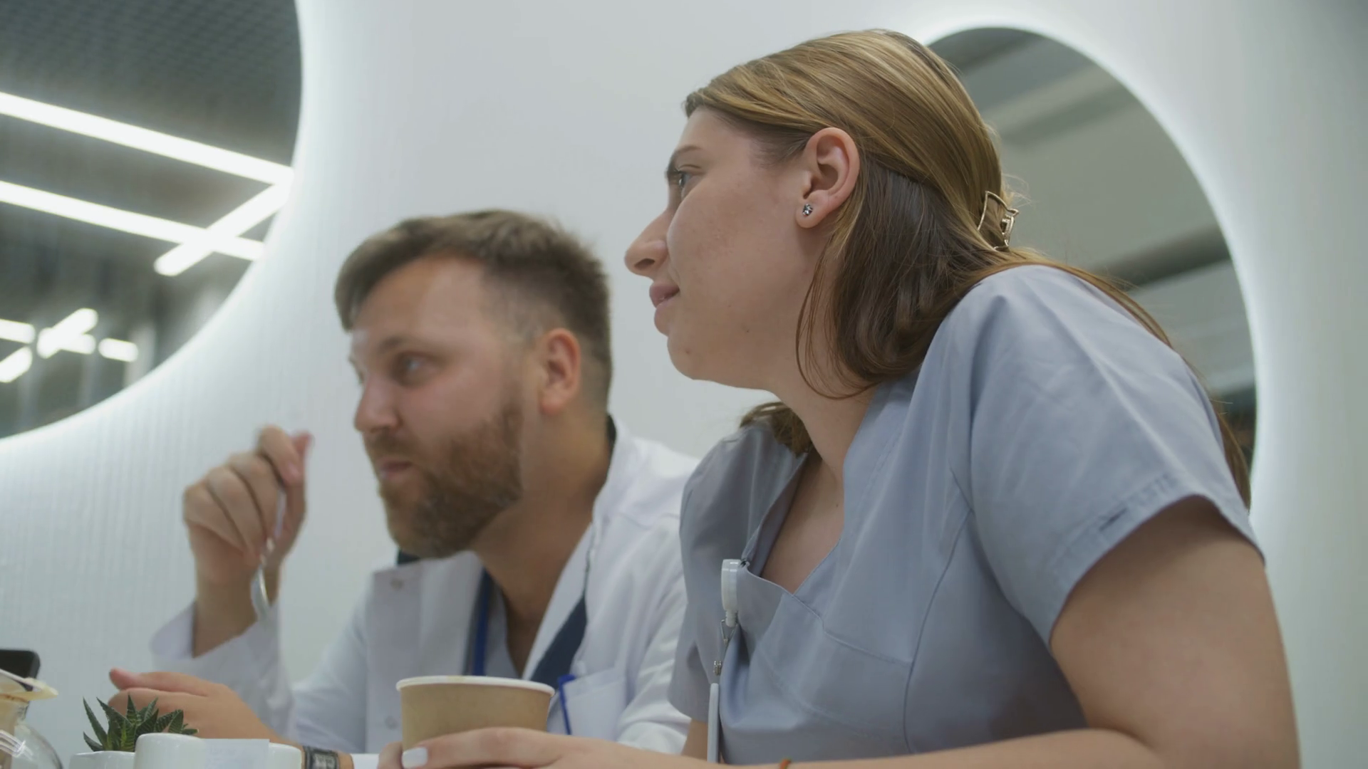 Male Doctor Nurse Sit In Modern Clinic Cafe Stock Footage SBV-348466244 ...