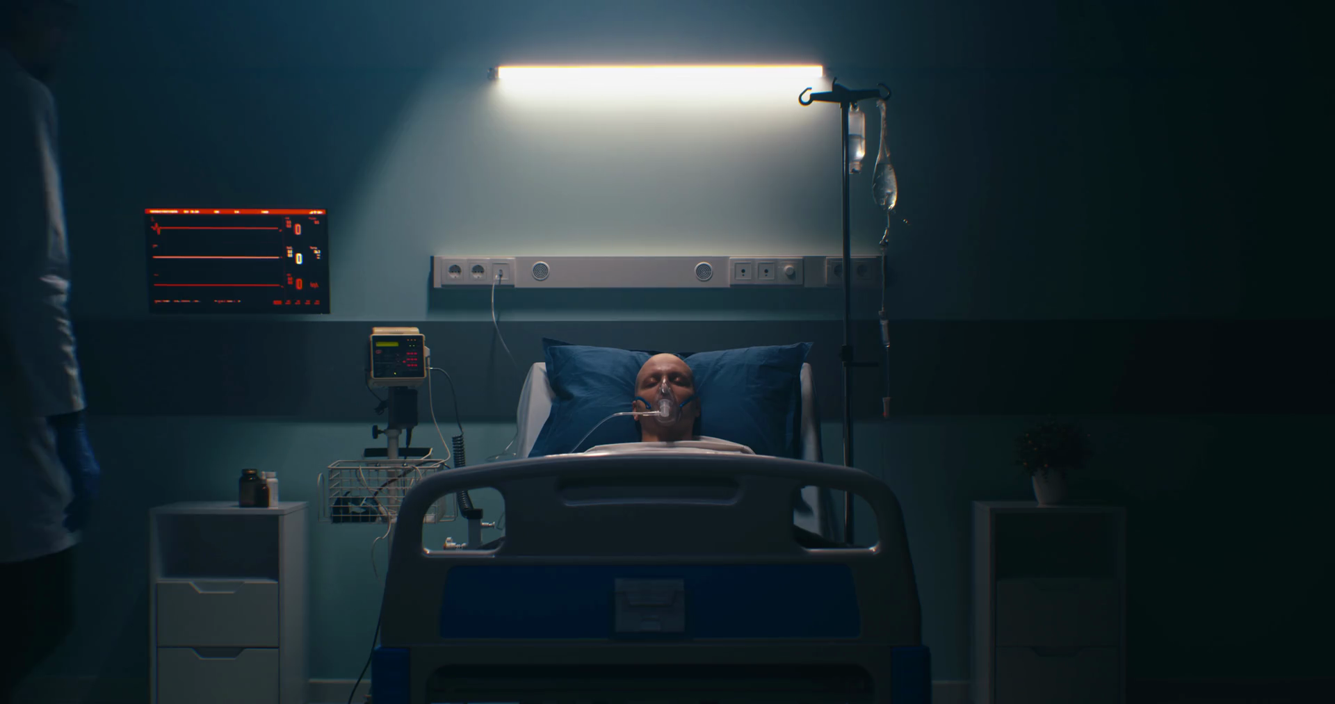 Mature medical practitioner turning off life support machine and ...