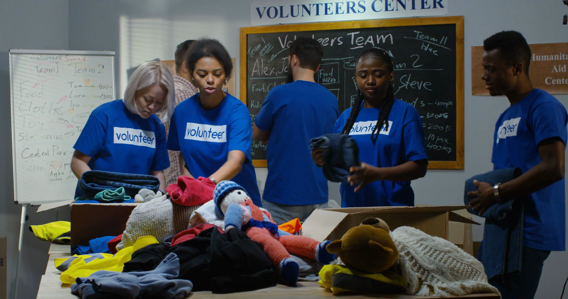 Medium Shot Of Volunteer Team Packing Stock Footage SBV-333321842 ...