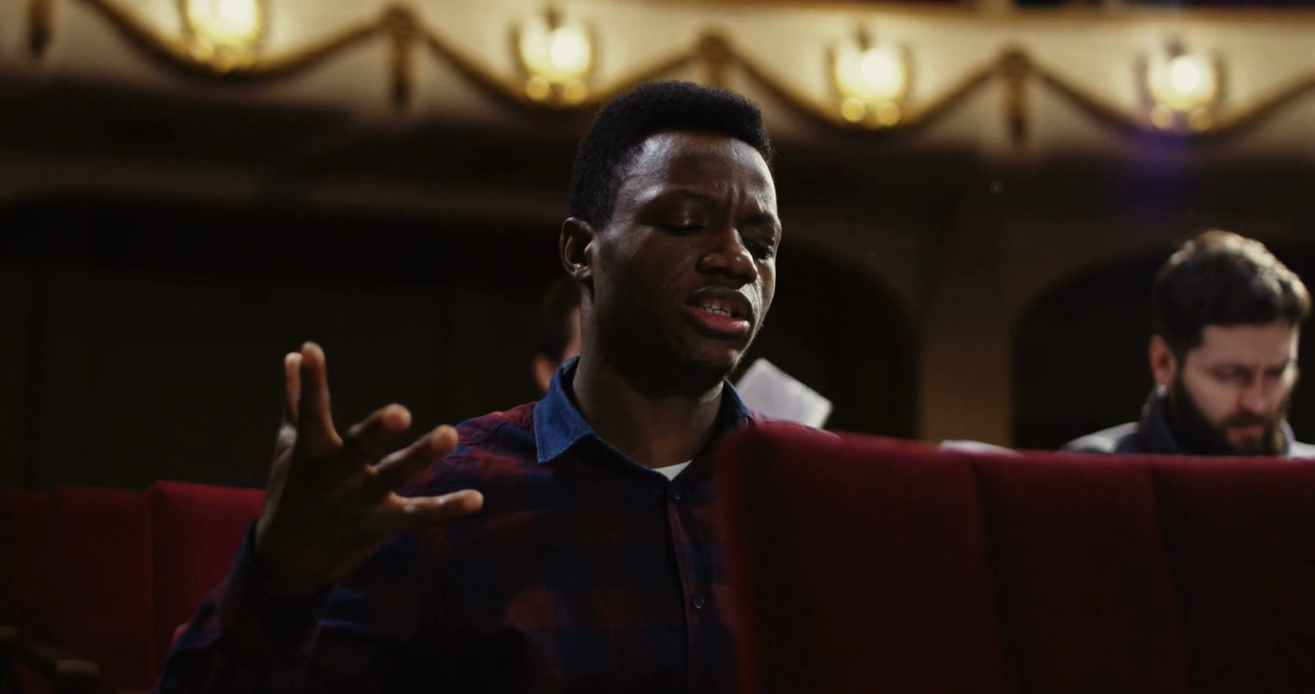 Medium shot of actors memorizing their lines while sitting in the ...