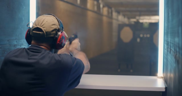 Man In Suit Firing Gun Stock Footage: Royalty-Free Video Clips ...