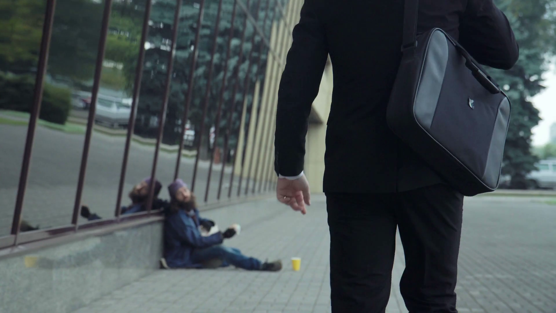 Passerby rich man walking and giving some money to homeless person ...