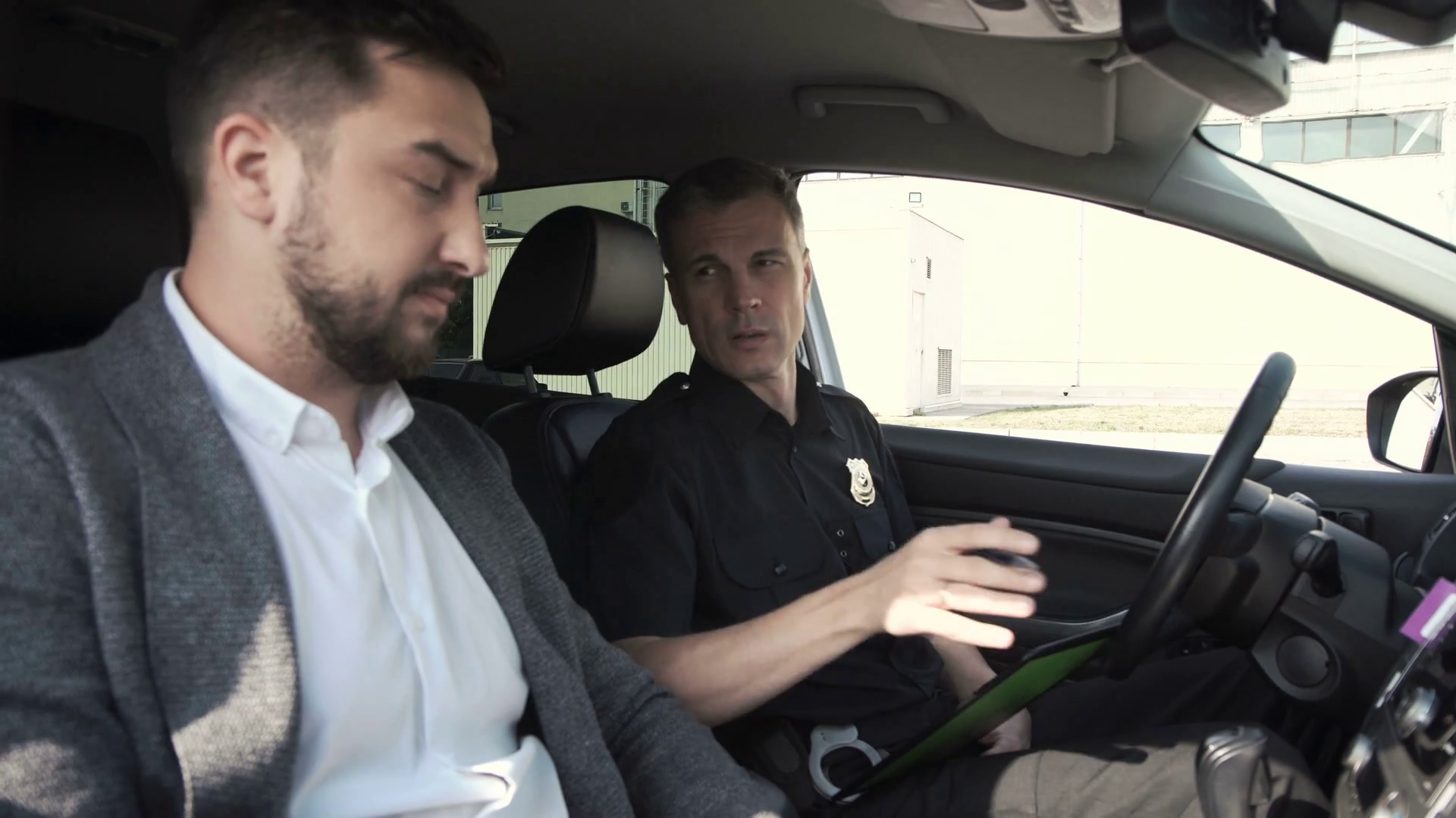 Police Officer Sitting In Car With Detained Stock Footage SBV-318243095 ...