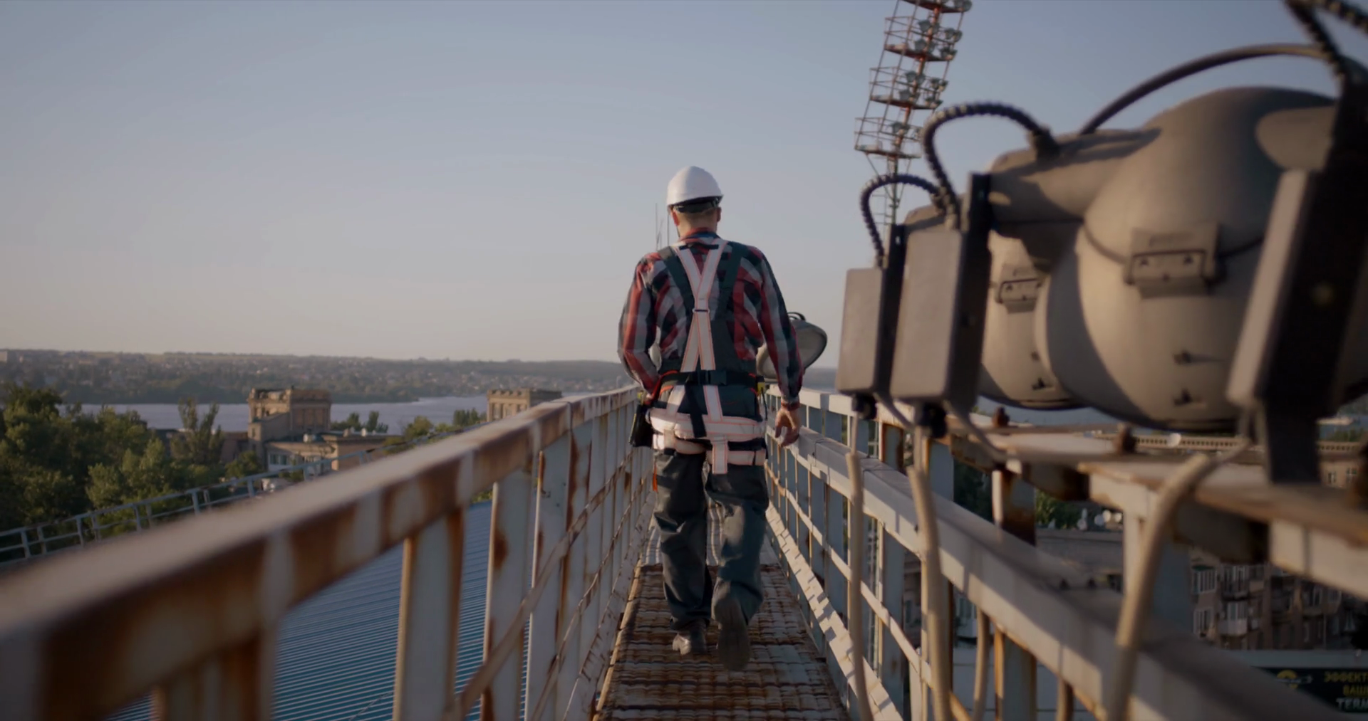 Tracking Shot Of An Engineer Walking On A Cellular Tower Stock Video 