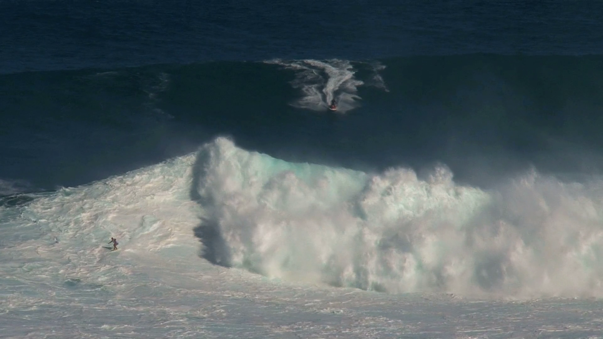 Surfers and jetski at the big wave surfing break Jaws in Peahi at the ...
