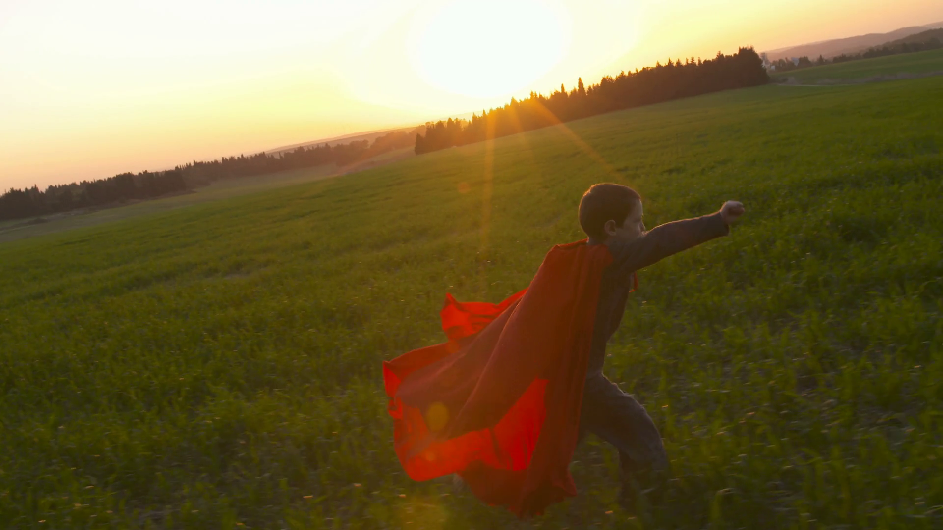 Boy With Superhero Cape Running In Field Stock Footage SBV-308654739 ...