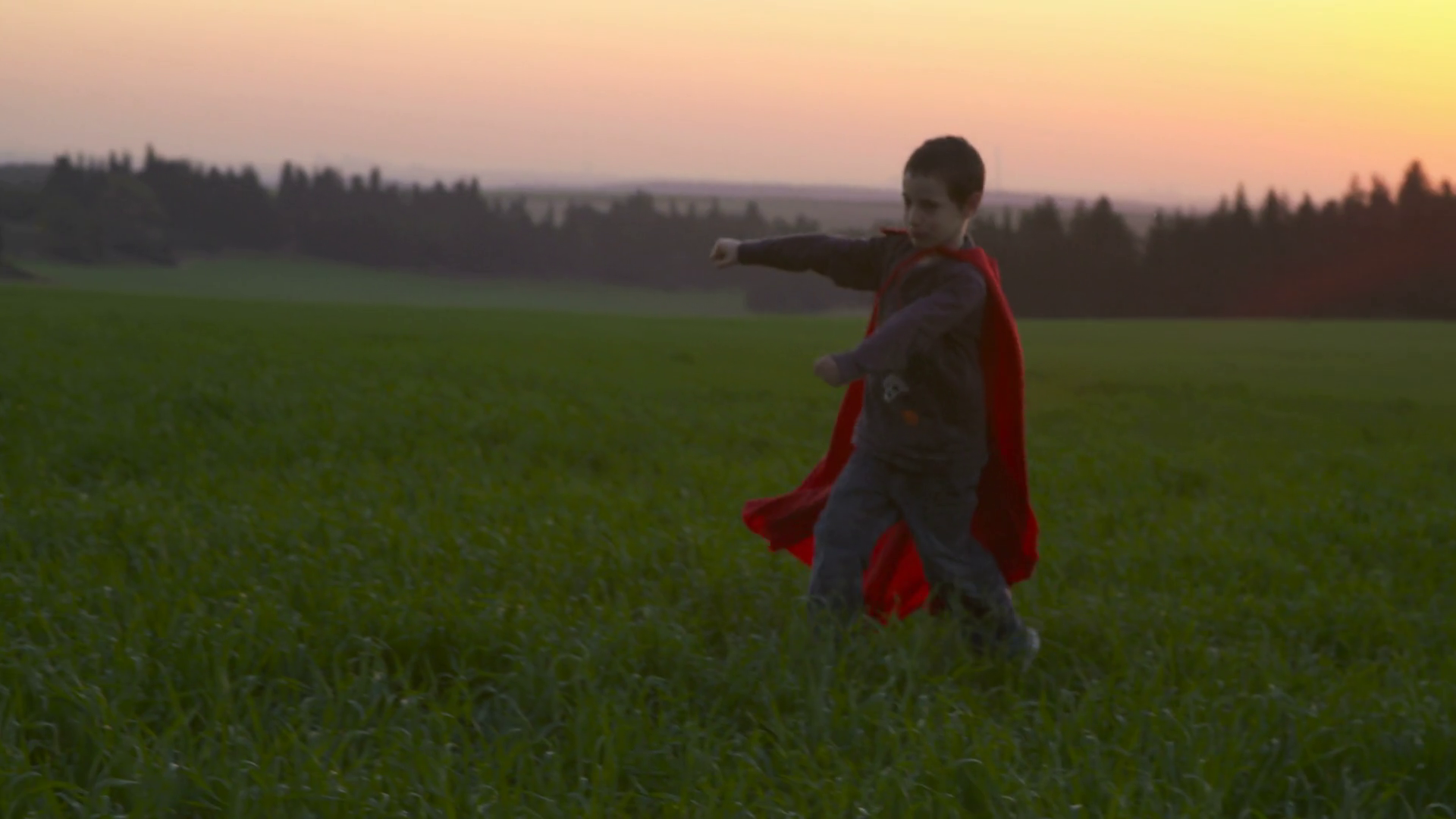 Boy With Superhero Cape Running In Field Stock Footage SBV-308654788 ...