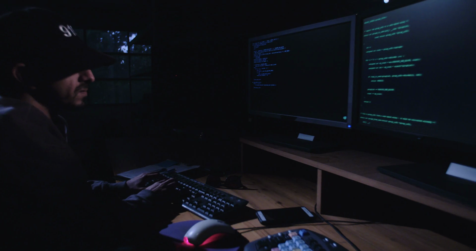 Hacker Sitting In Dark Room In Front Of Stock Footage SBV-309840259 ...