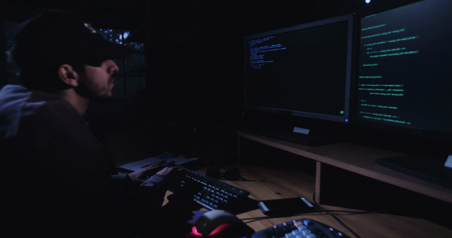 Hacker Sitting In Dark Room In Front Of Stock Footage SBV-309840238 ...