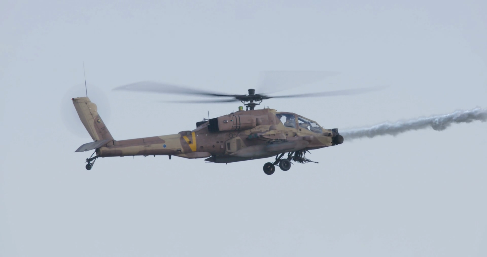 Apache military helicopter firing hellfire missile Stock Video Footage ...