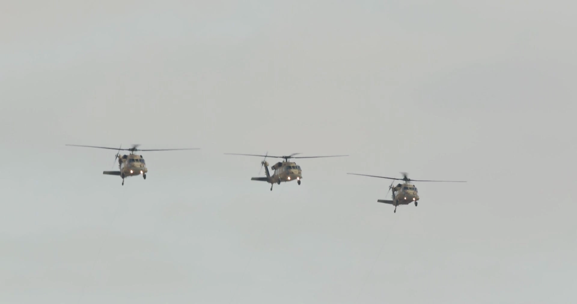 BlackHawk military helicopters flying in formation Stock Video Footage ...