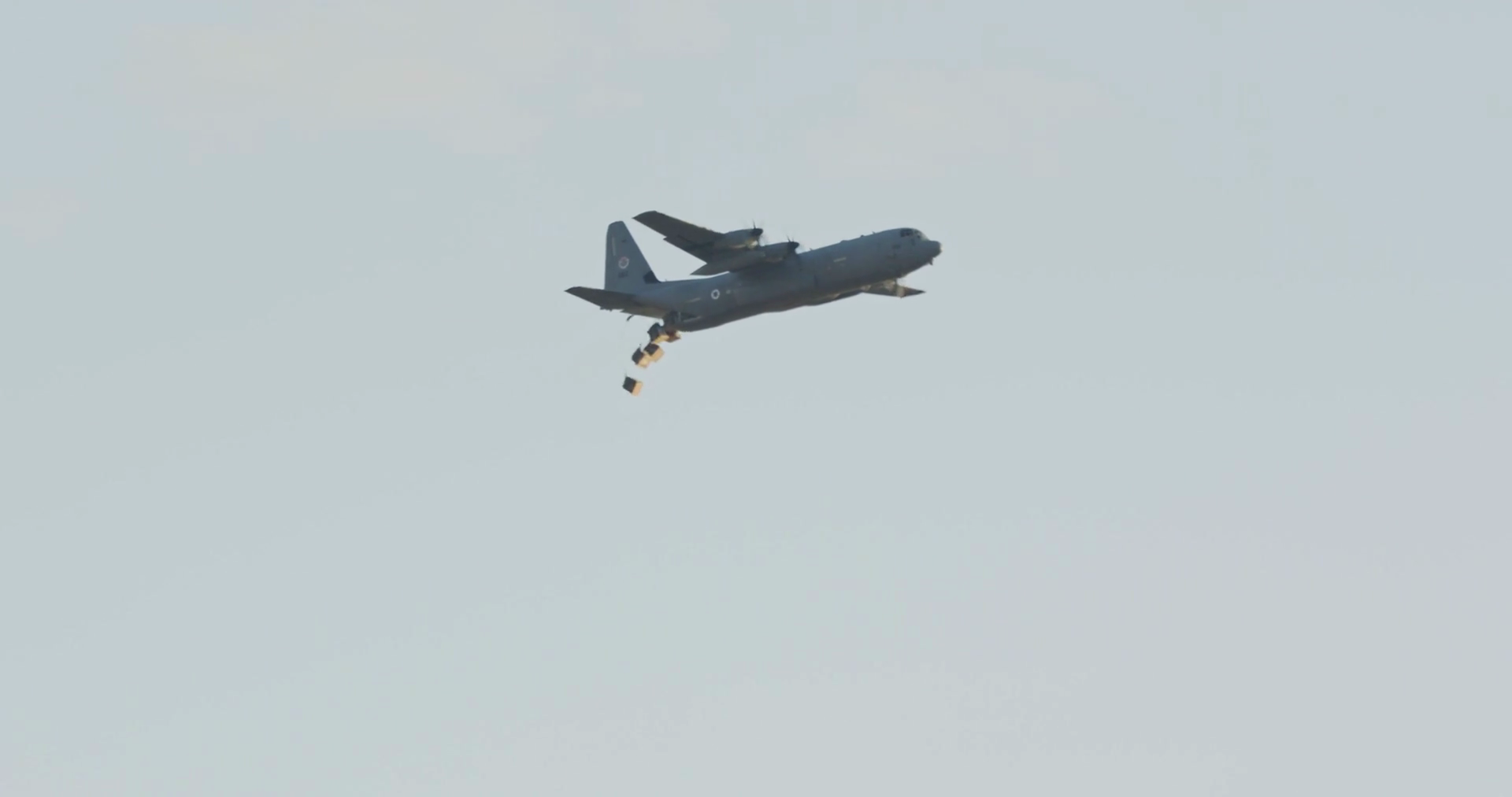 C-130 Transport Plane Dropping Cargo Packs Stock Footage SBV-330428778 ...