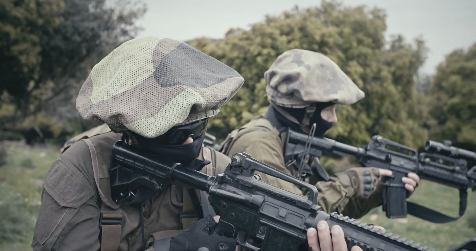 Squad of fully armed commando soldiers during combat in a forest ...