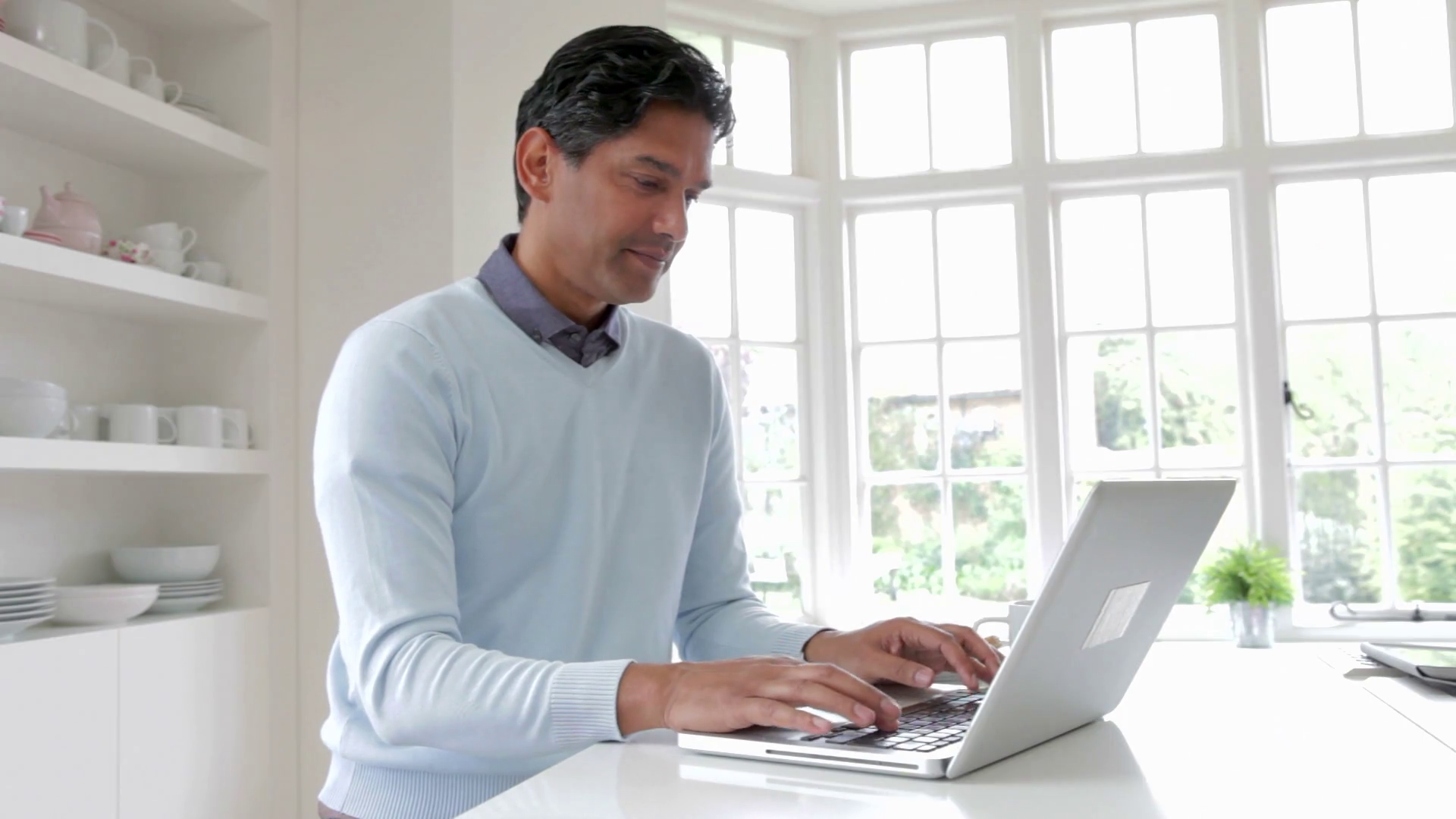 Indian Man Using Laptop Computer Whilst Stock Footage SBV-301687123 ...