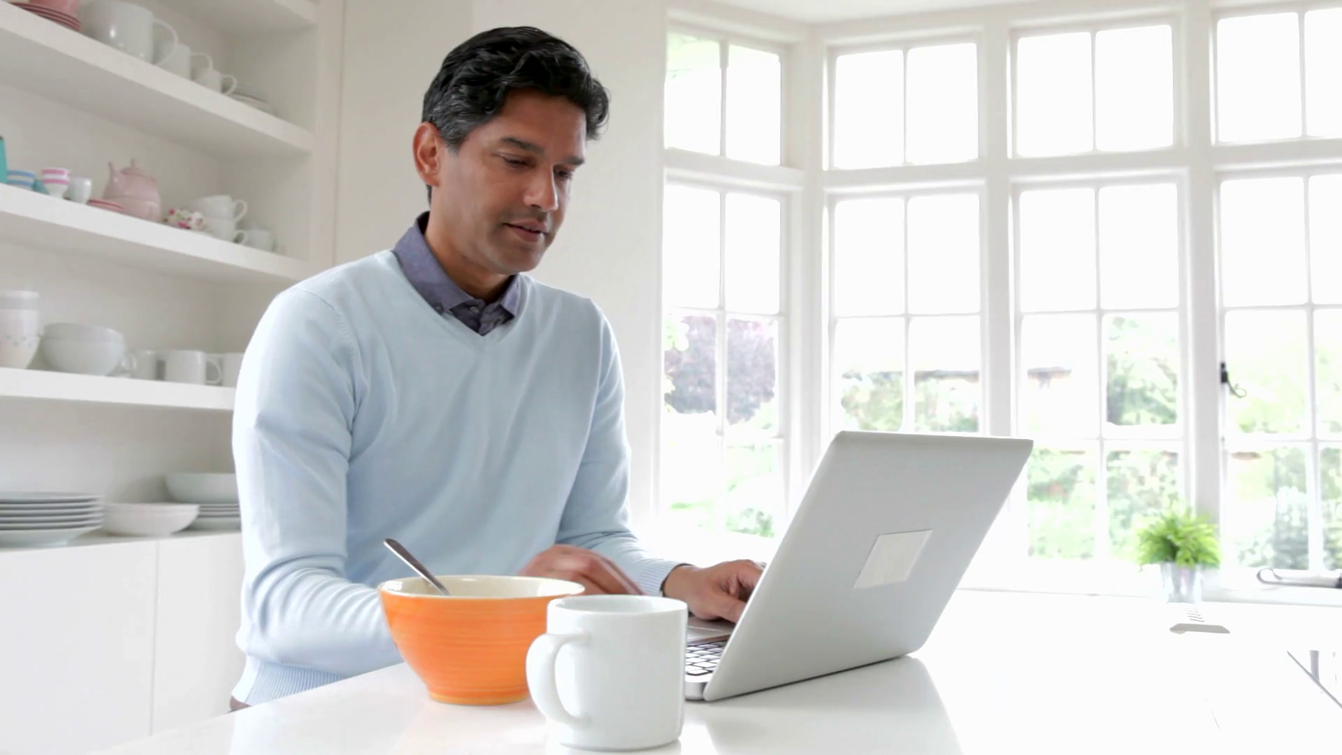 Indian Man Using Laptop Computer Whilst Stock Footage SBV-301687134 ...