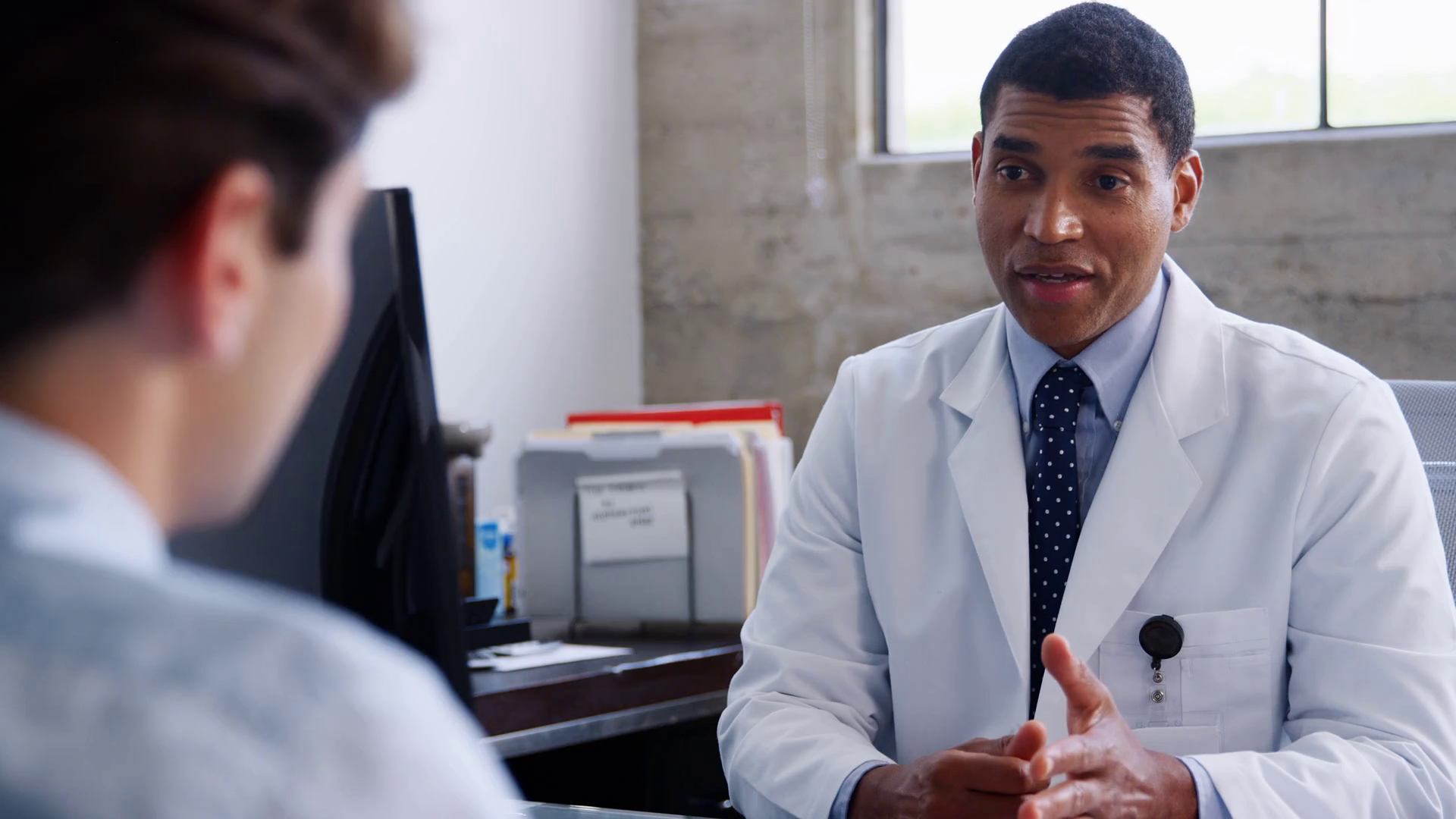 Concerned Mixed Race Male Doctor Speaking To Stock Footage SBV ...