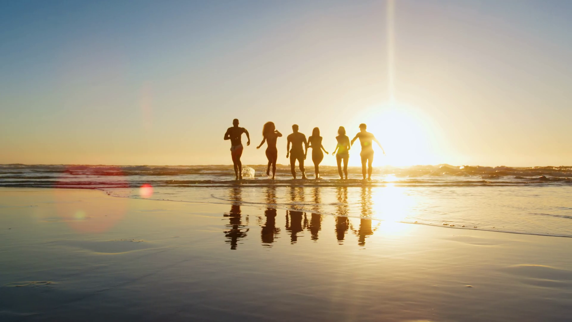 Friends Running Through Waves At Sunset On Stock Footage SBV-323723645 ...