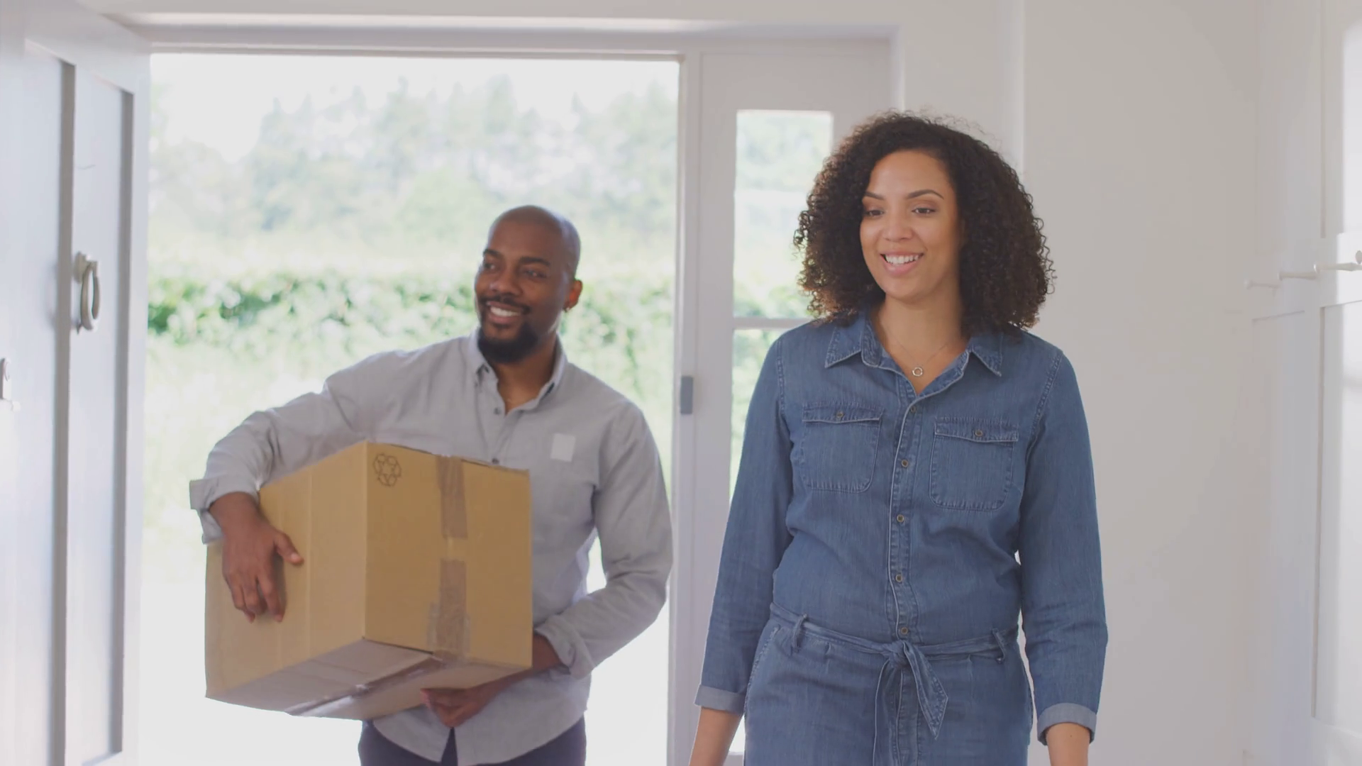 Couple Carrying Boxes Hugging In Hallway Of Stock Footage SBV-346689549 ...