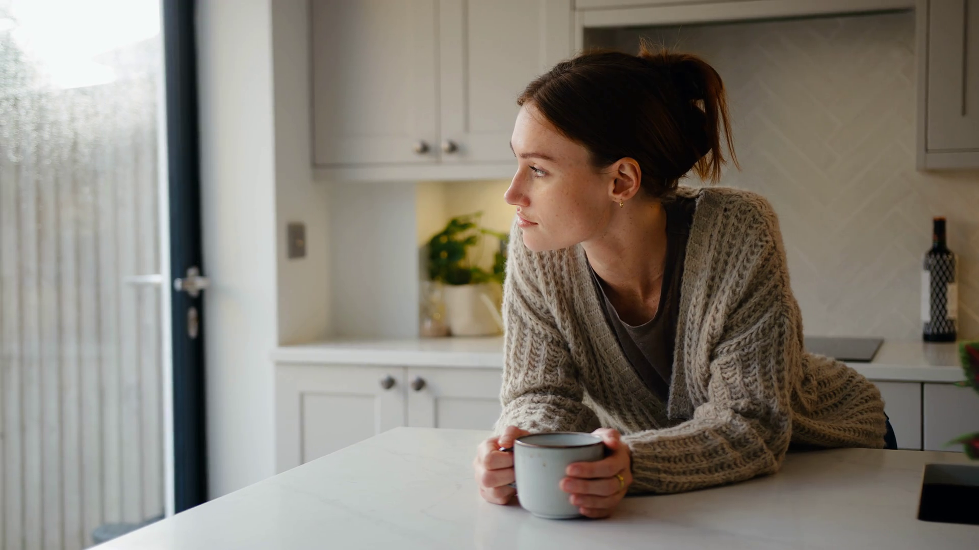 Portrait Of Young Woman Leaning On Kitchen Stock Footage SBV-348734678 ...