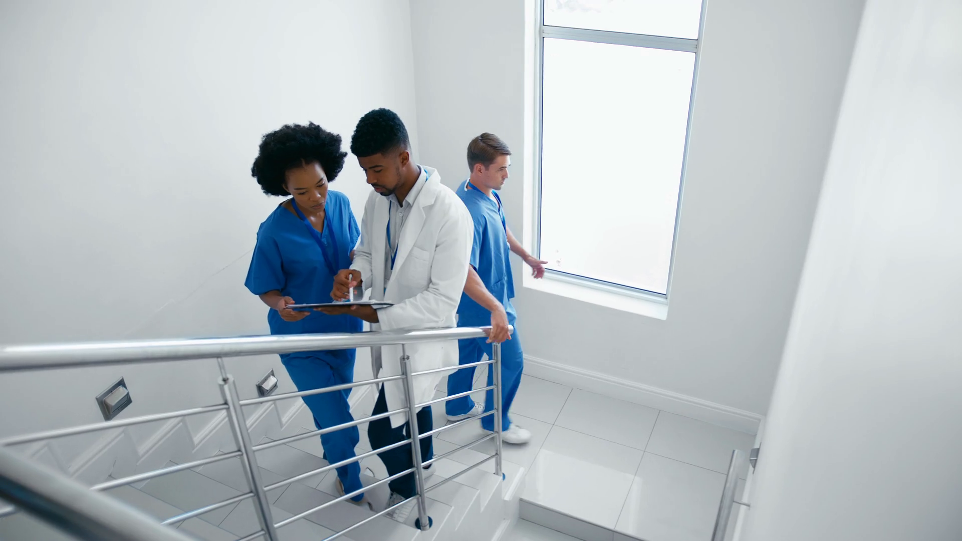 Male Doctor Female Nurse With Clipboard Stock Footage SBV-347668548 ...
