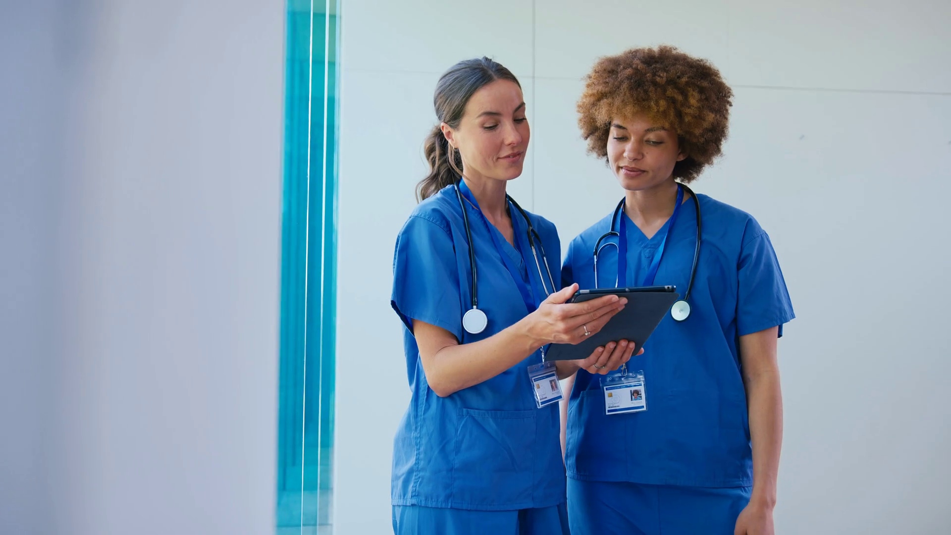 Two Female Doctors Wearing Scrubs With Stock Footage SBV-348705198 ...