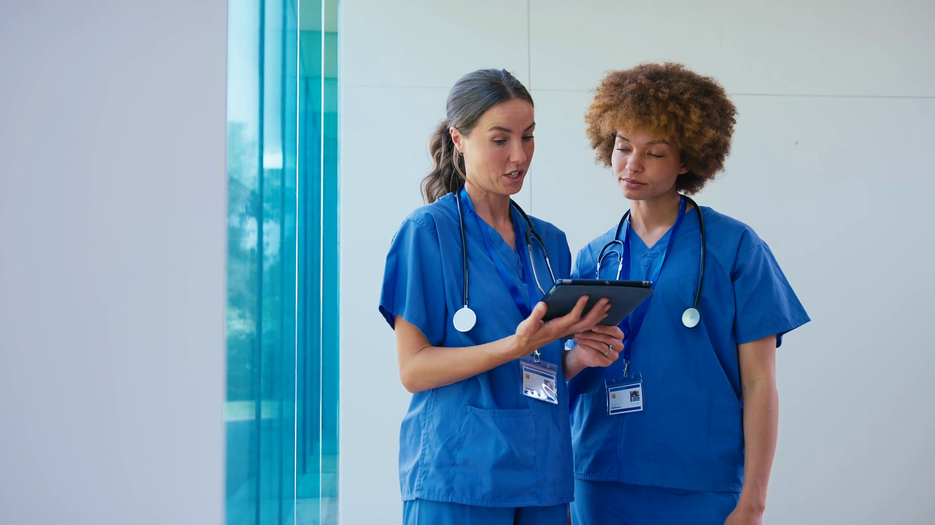 Two Female Doctors Wearing Scrubs With Stock Footage SBV-348705235 ...