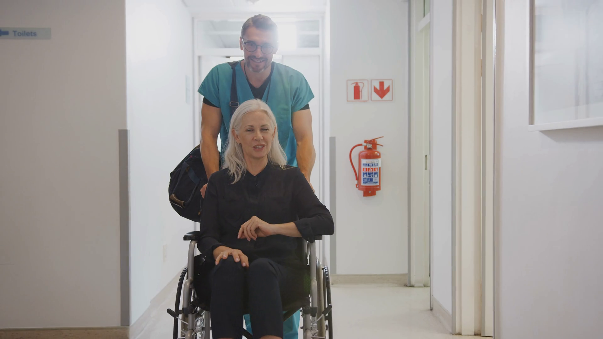 Male Orderly Pushing Senior Female Patient Stock Footage SBV-335967679 ...