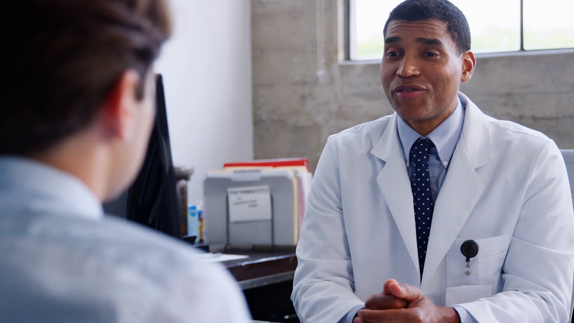 Doctor Speaking To Young Patient Stock Footage SBV-328043826 - Storyblocks