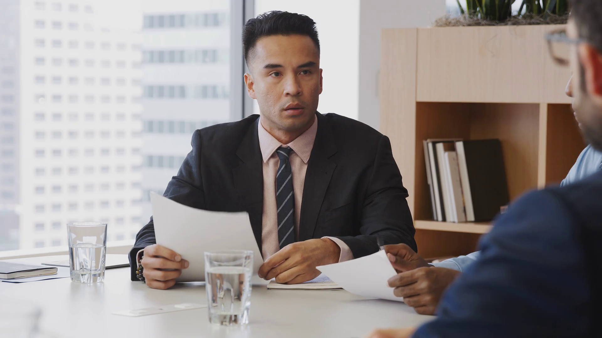 Three Businessmen Sitting Around Table Stock Footage SBV-335967341 ...