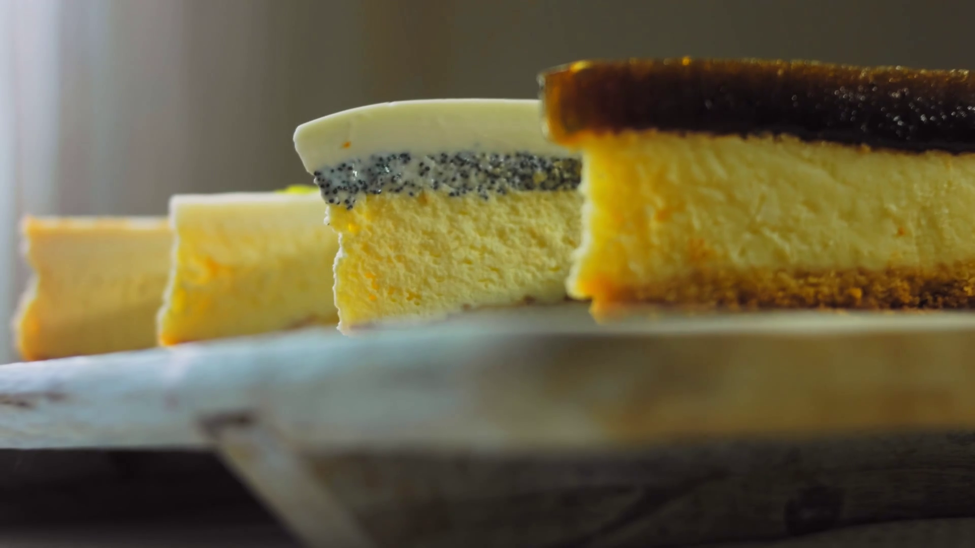 Four Kinds Of Cheesecake Arranged In Row Stock Footage SBV-347210409 ...