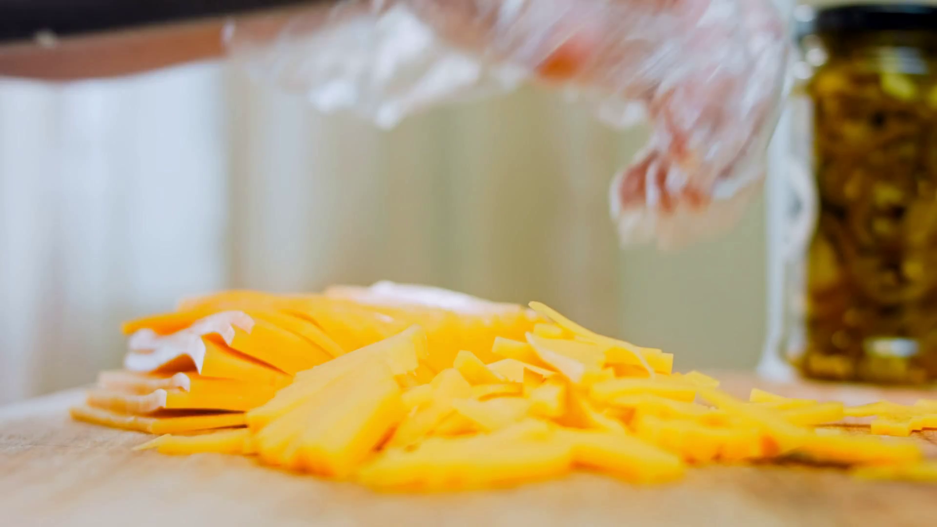 Cutting cheddar on board close-up. Hard cheese, fresh cheddar Stock ...
