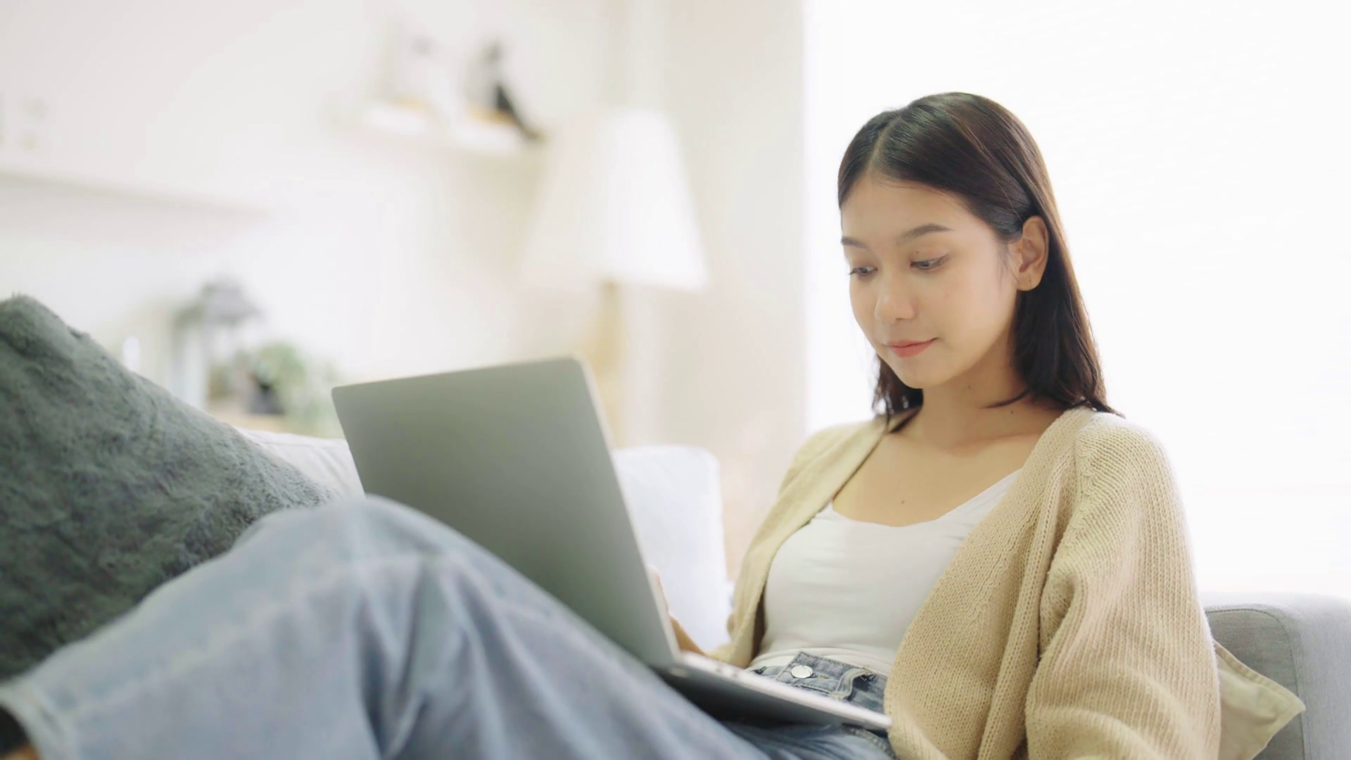 Young Asian Woman Using Laptop Seated On Stock Footage SBV-347507919 ...