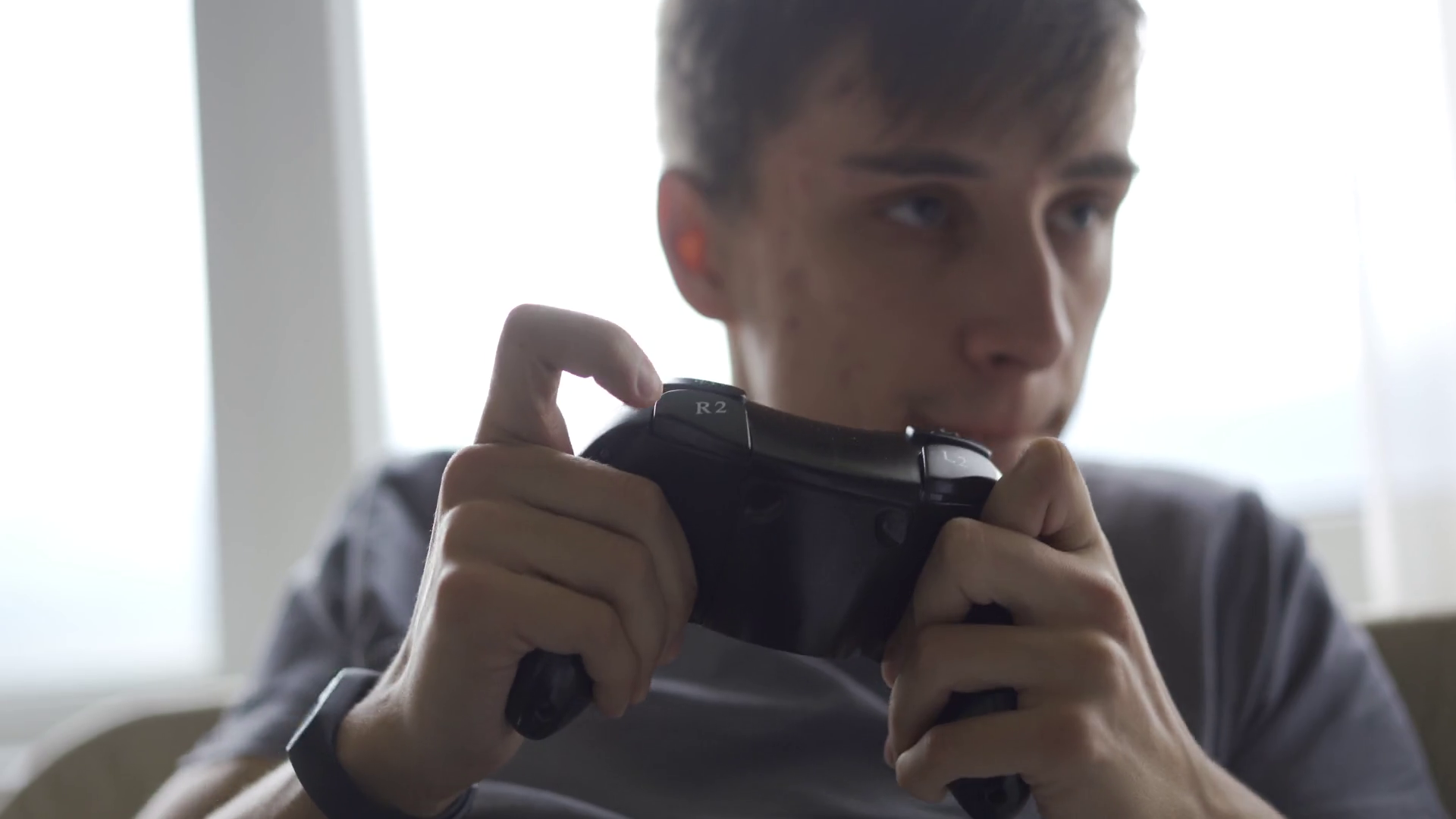 Professional Boy Gamer Plays in Video Game. Looks realy focused. Super ...