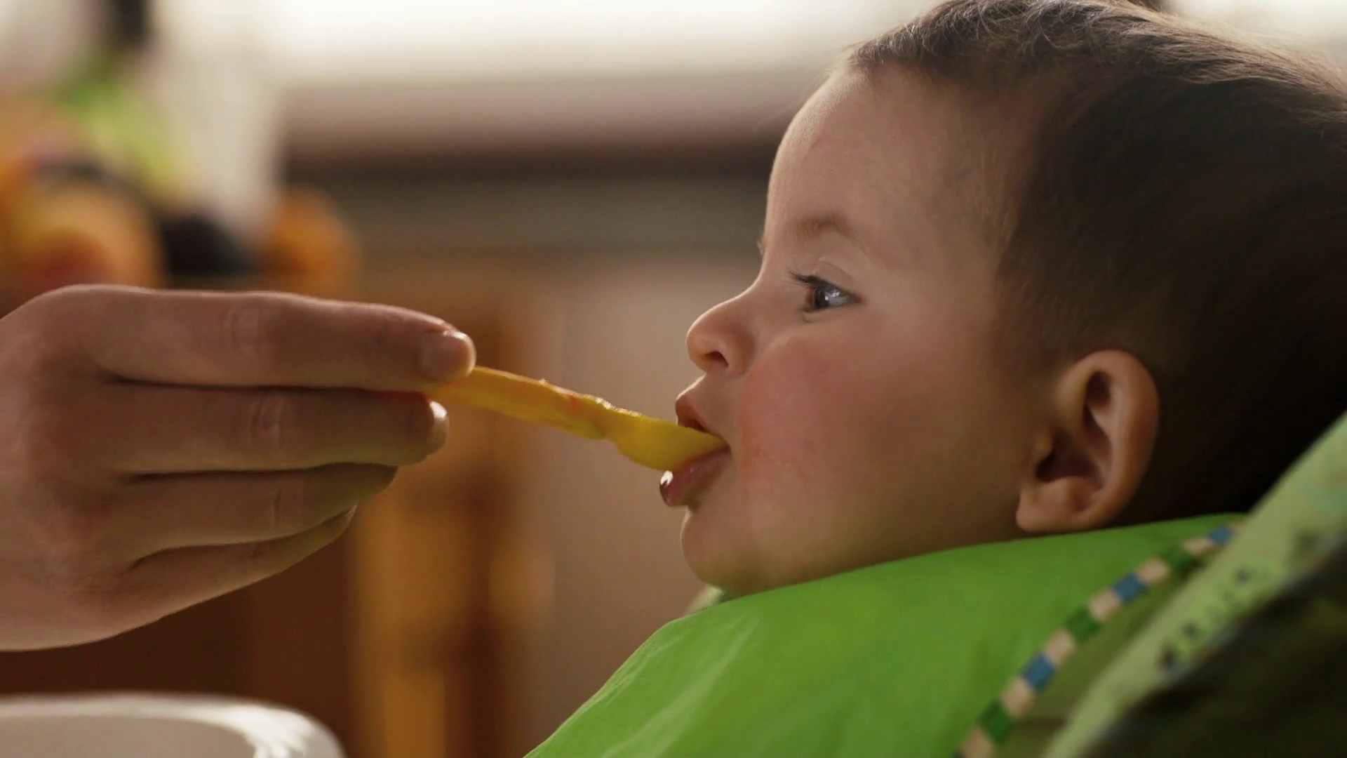 Children and nutrition, mother feeding baby girl in home kitchen for ...