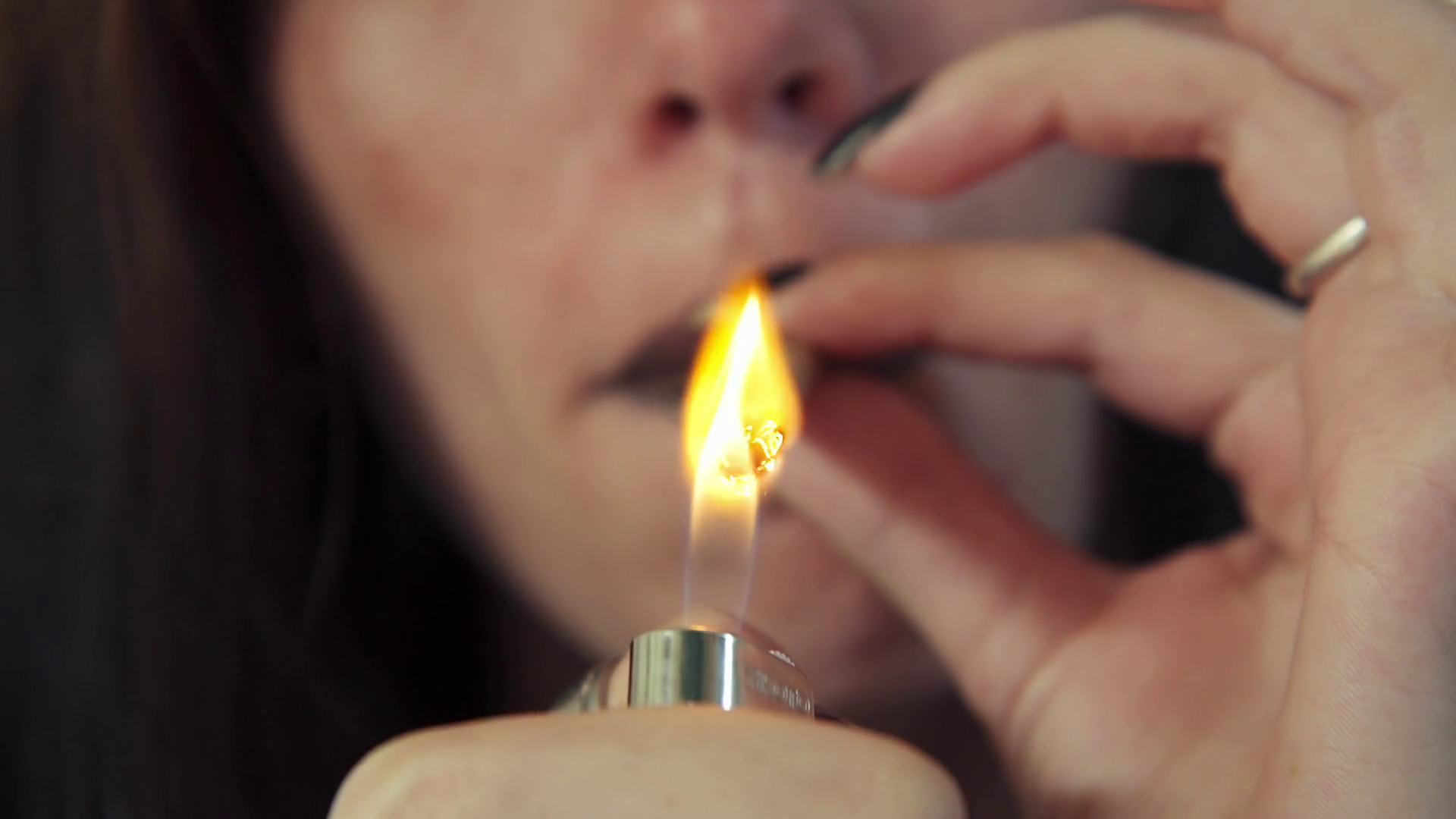 Latina Woman With Lighter Smoking Hashish Joint Marijuana Cigarette ...