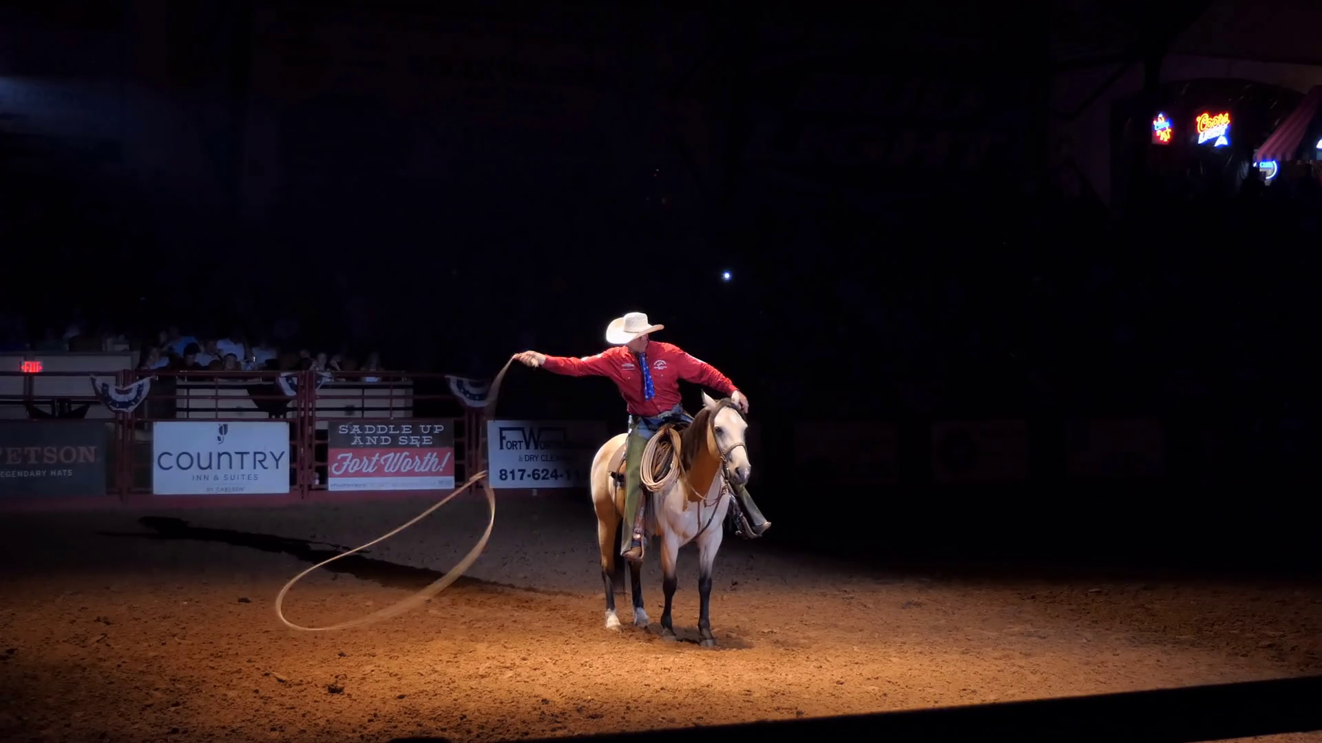 American cowboy performing lasso show on horse at rodeo in Cowtown ...