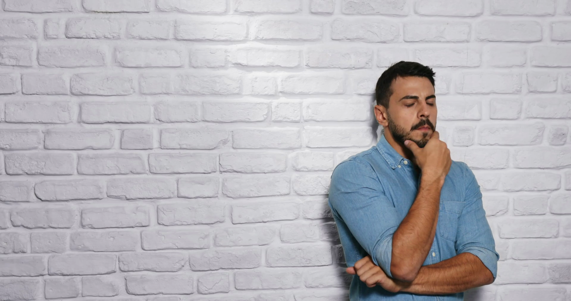 Expressions Of Young Man Against Brick Wall Stock Footage SBV-322100783 ...