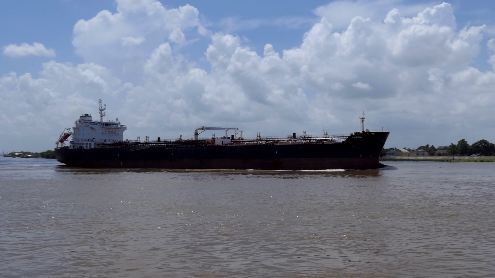 Gas carrier or gas tanker during navigation on the Mississippi river ...