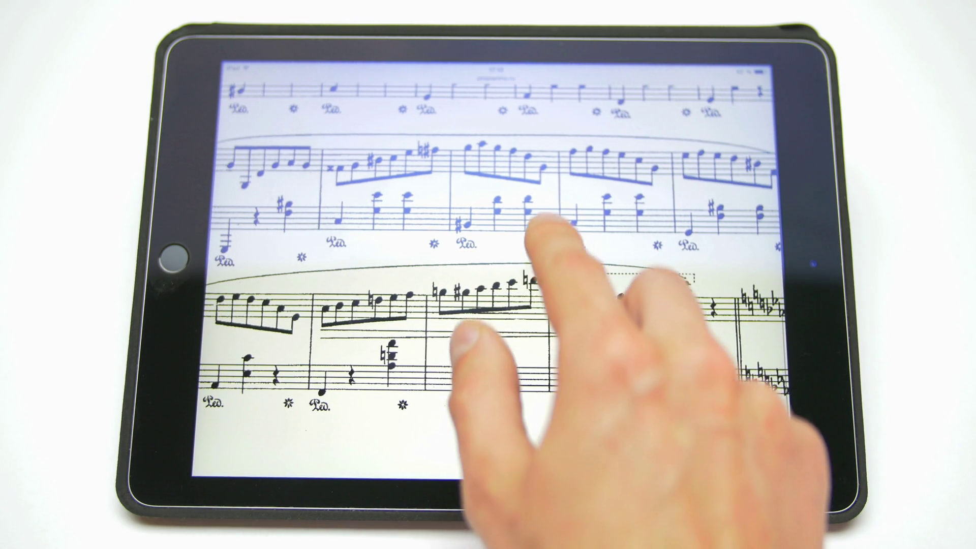 The hand (finger) work with music notes on the touchscreen by white ...