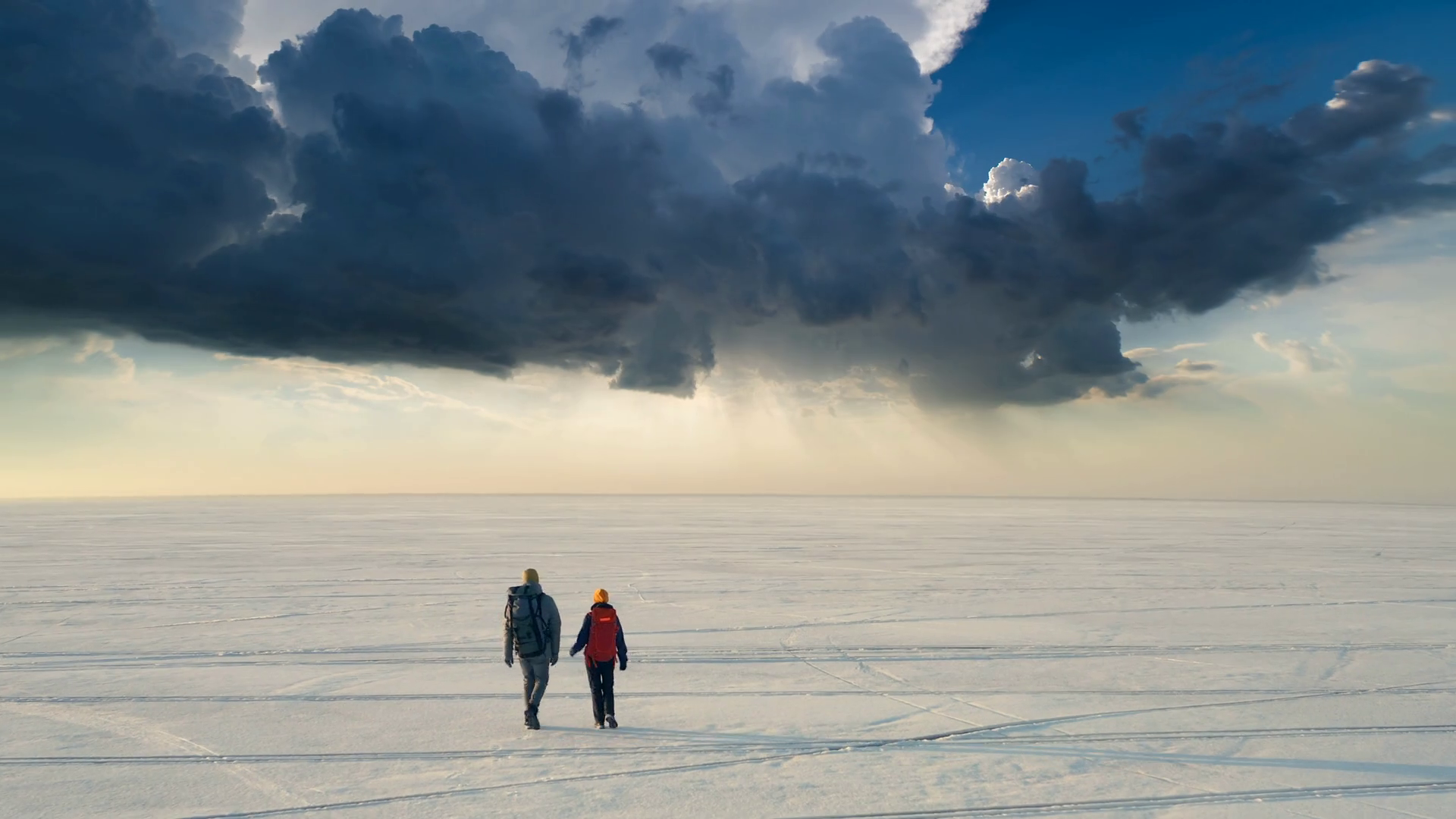 The two backpackers walking through the icy snow field Stock Video ...