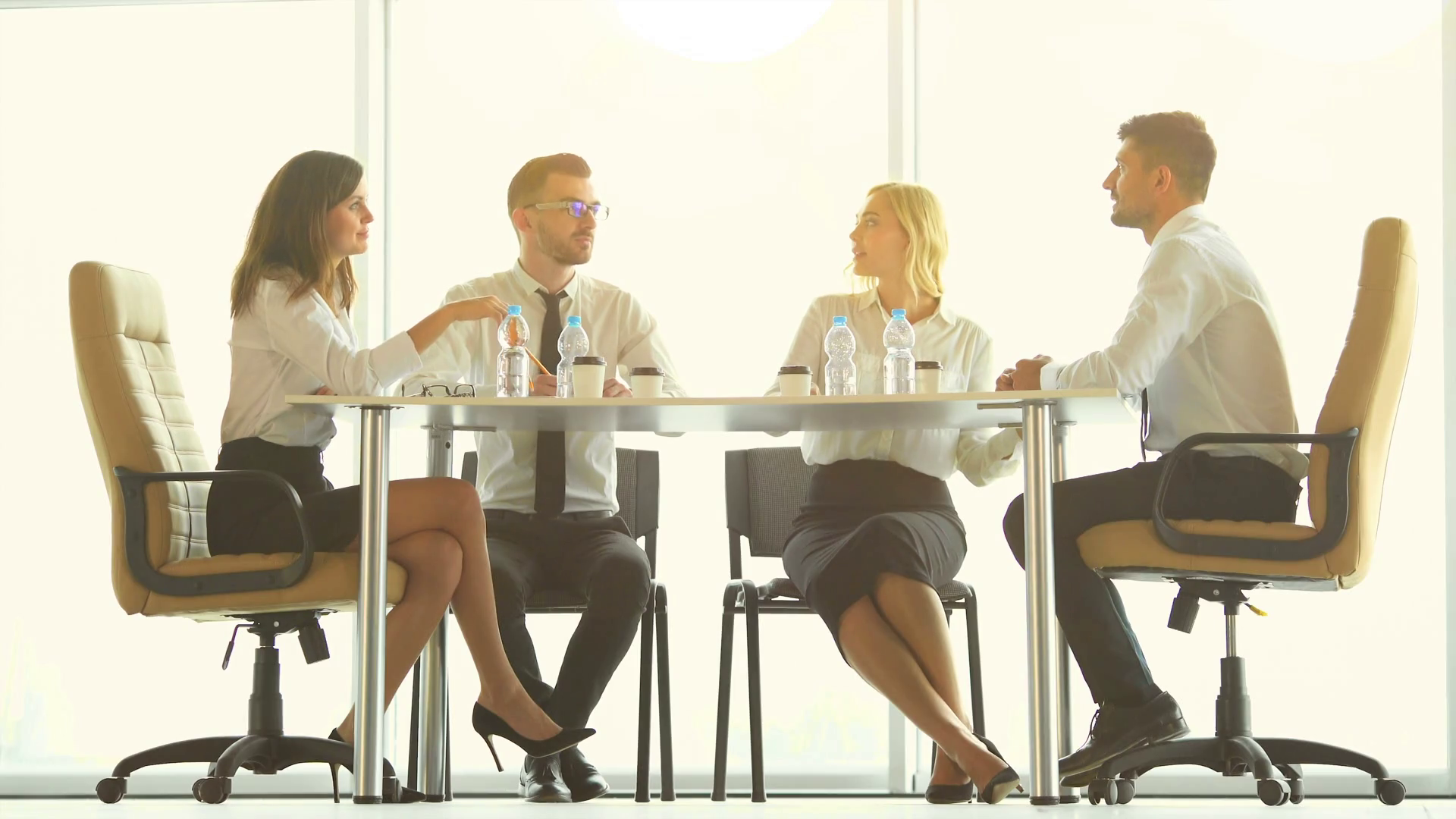 The four business people discuss at the table Stock Video Footage ...