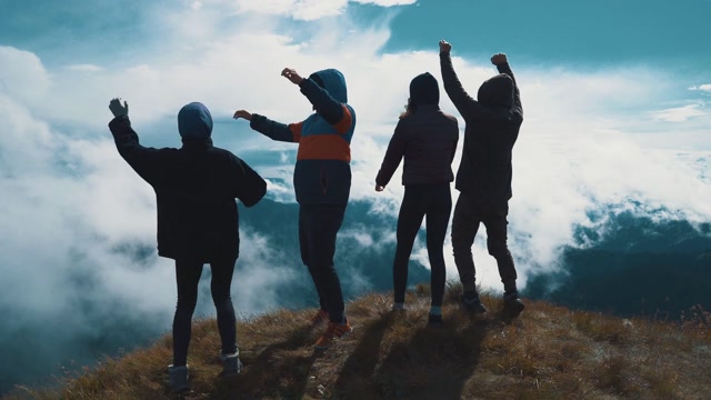 Four People Standing On Mountain Stock Footage: Royalty-Free Video Clips - Storyblocks