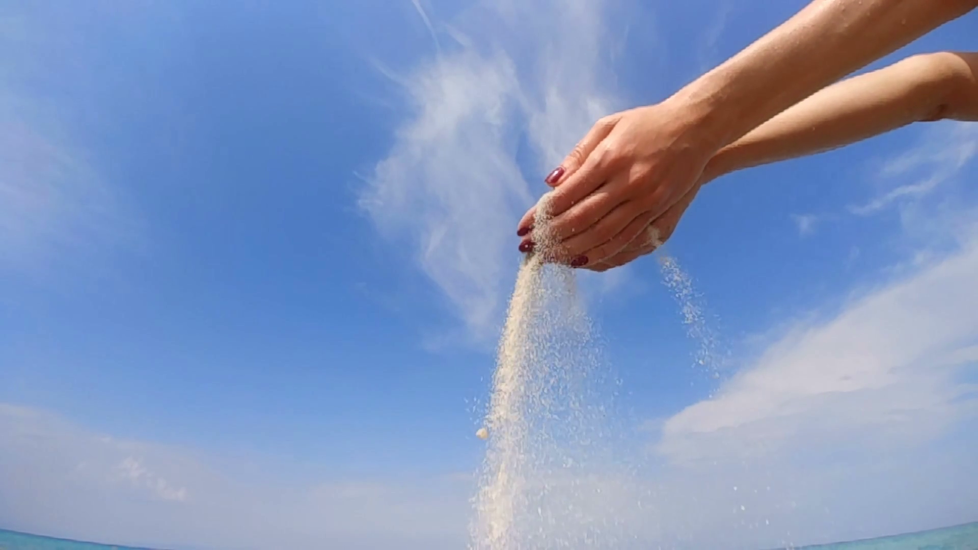 The hands pouring the sand in the sea. slow motion Stock Video Footage ...
