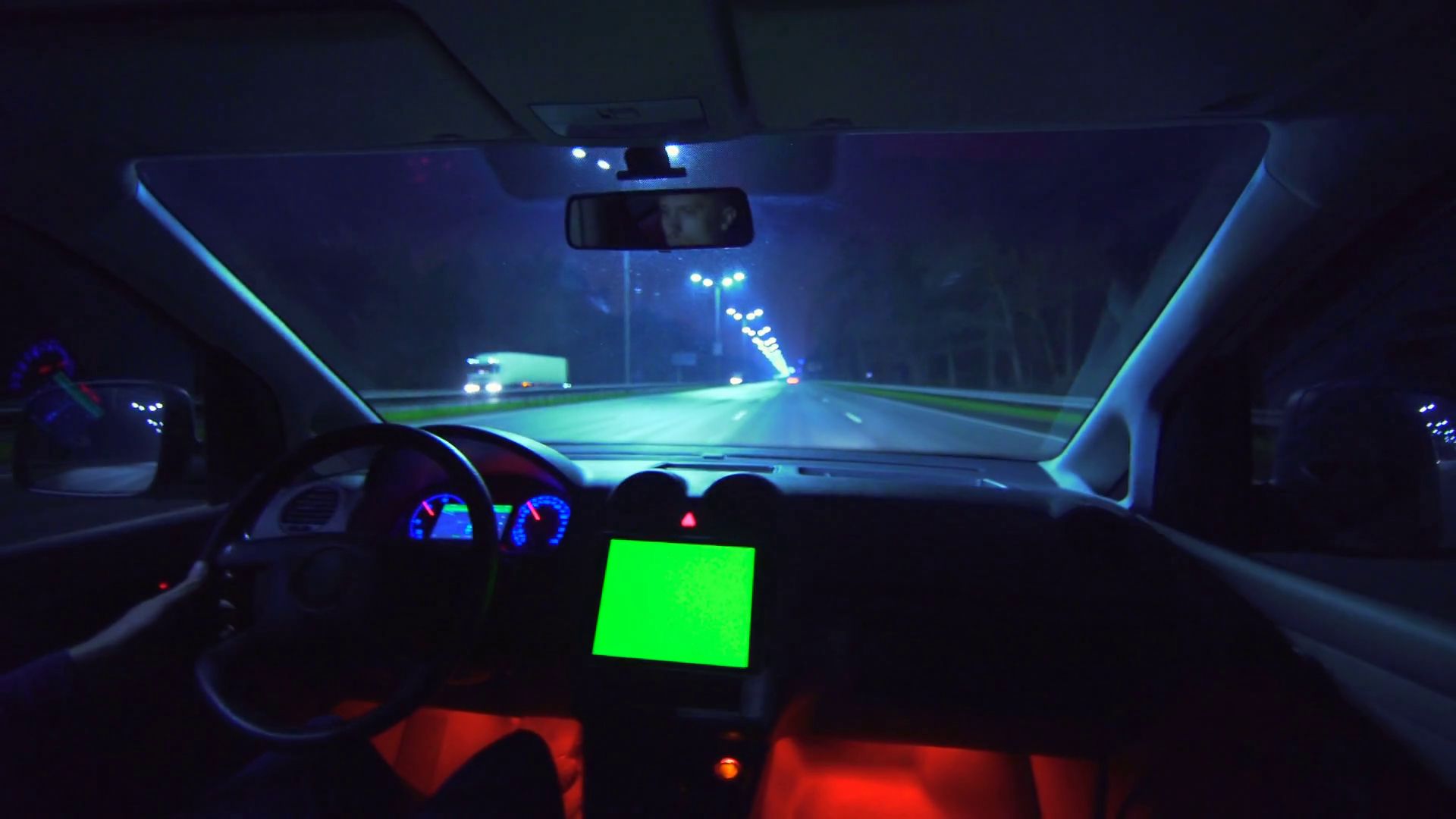 The man drive a car on the night autobahn. inside view. wide angle ...